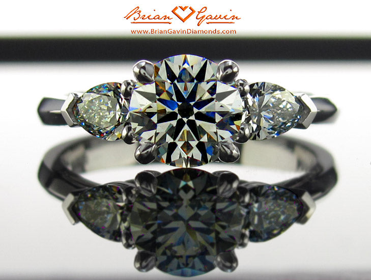Three Stone Engagement Rings with Pear Shape Side Stones are Very Popu
